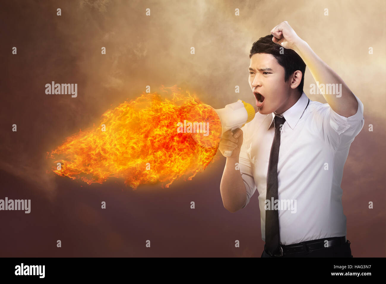 Business man holding megaphone in fire and shouting with furious Stock ...