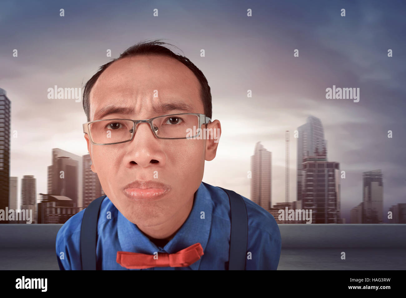 Nerdy man confused expression standing on the rooftop Stock Photo - Alamy