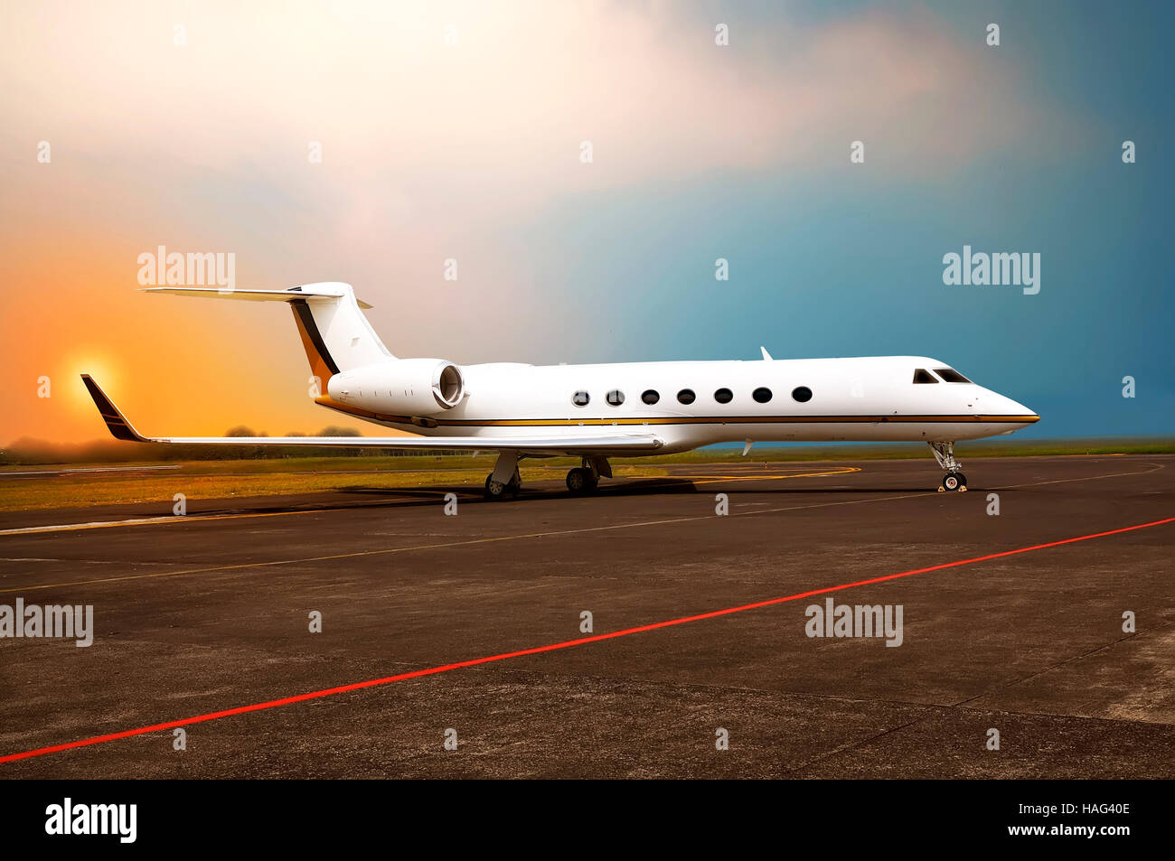 Private jet airplane parking at the airport. With sunset background ...