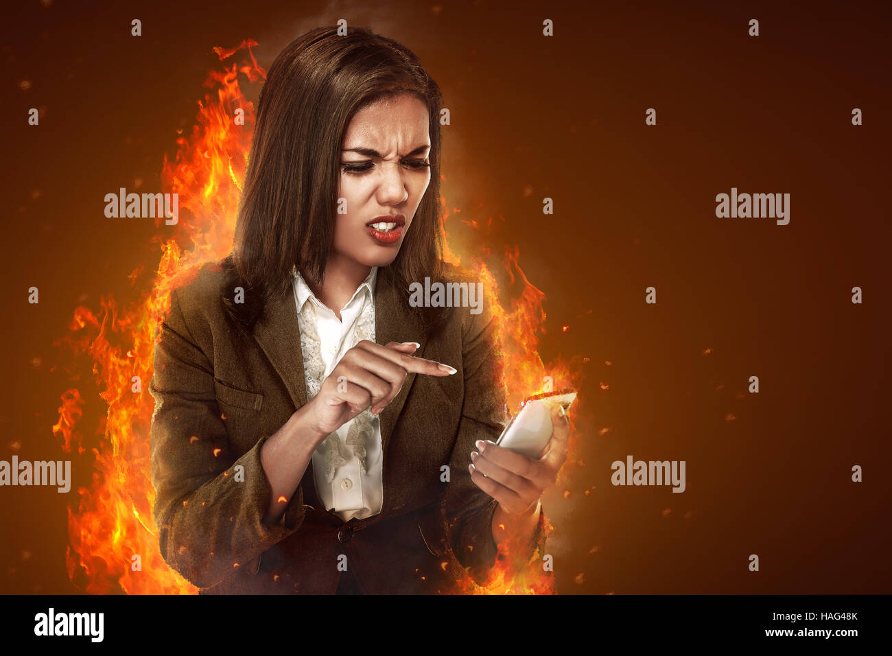 Asian business woman angry looking text on her cellphone Stock Photo ...