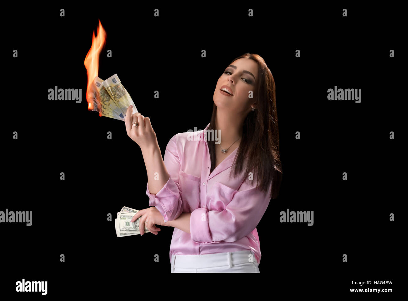 Woman burning money hi-res stock photography and images - Alamy