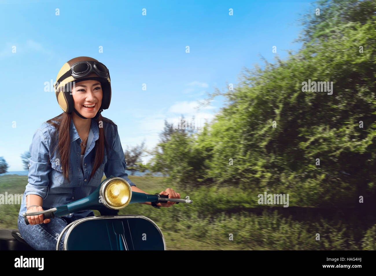 Young chinese woman riding motorcycle hi-res stock photography and ...