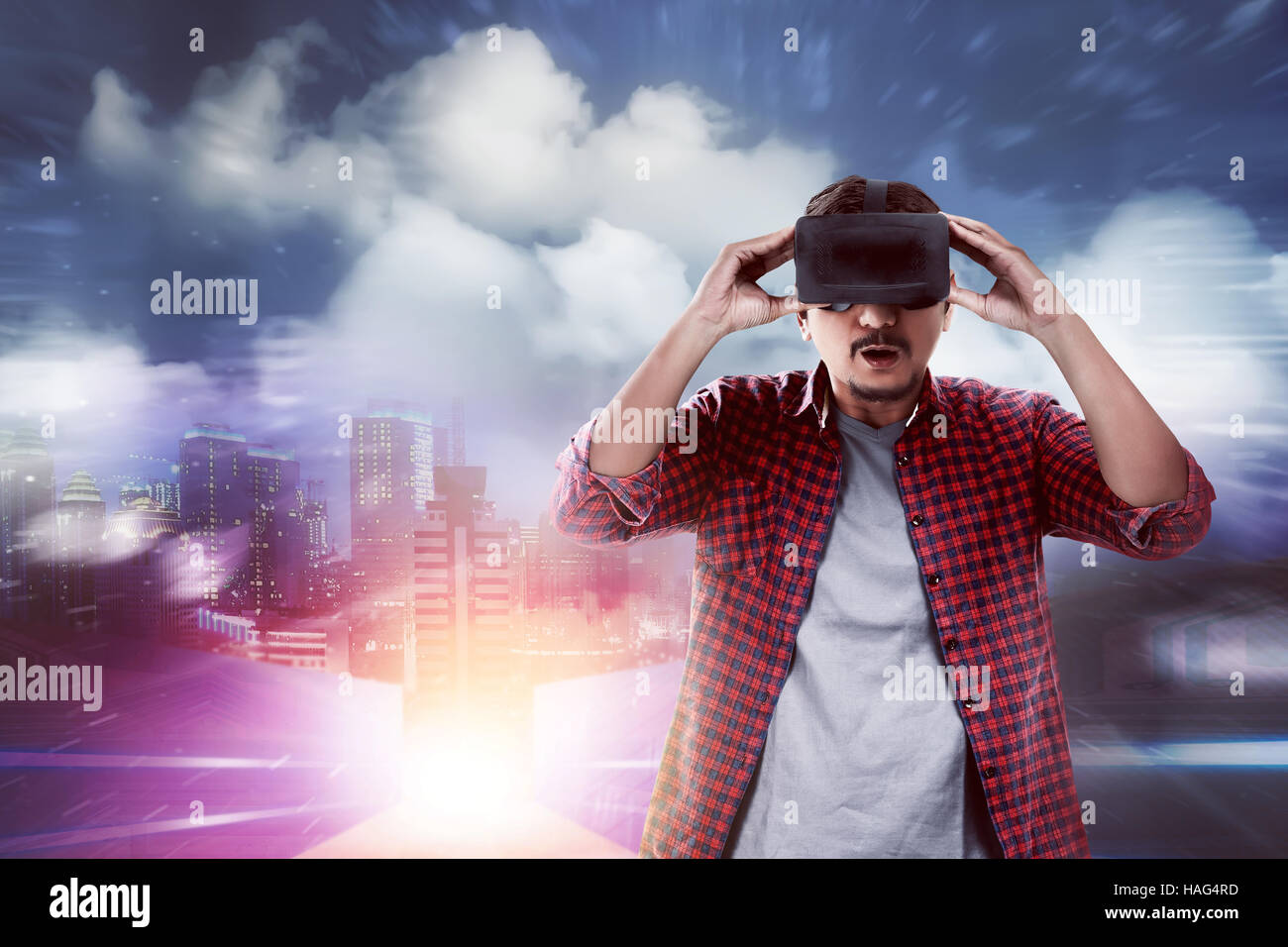 Young asian man wear VR headset get into virtual reality world Stock ...