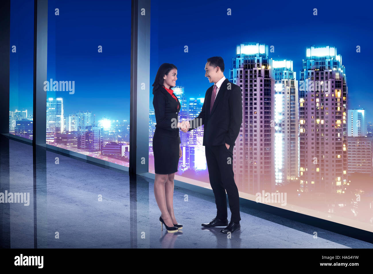 Business man and woman shaking hand over office window background Stock ...
