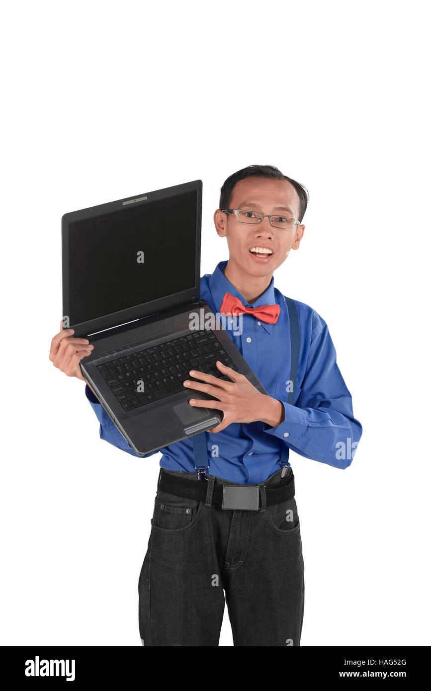 Nerd man holding laptop isolated over white background Stock Photo - Alamy