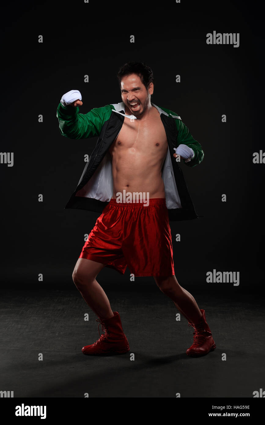 Young asian boxer training boxing against black background Stock Photo ...