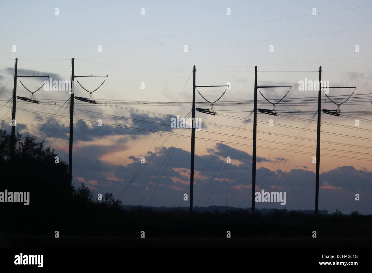 Utility Poles and Wires with Sunrise Stock Photo - Alamy