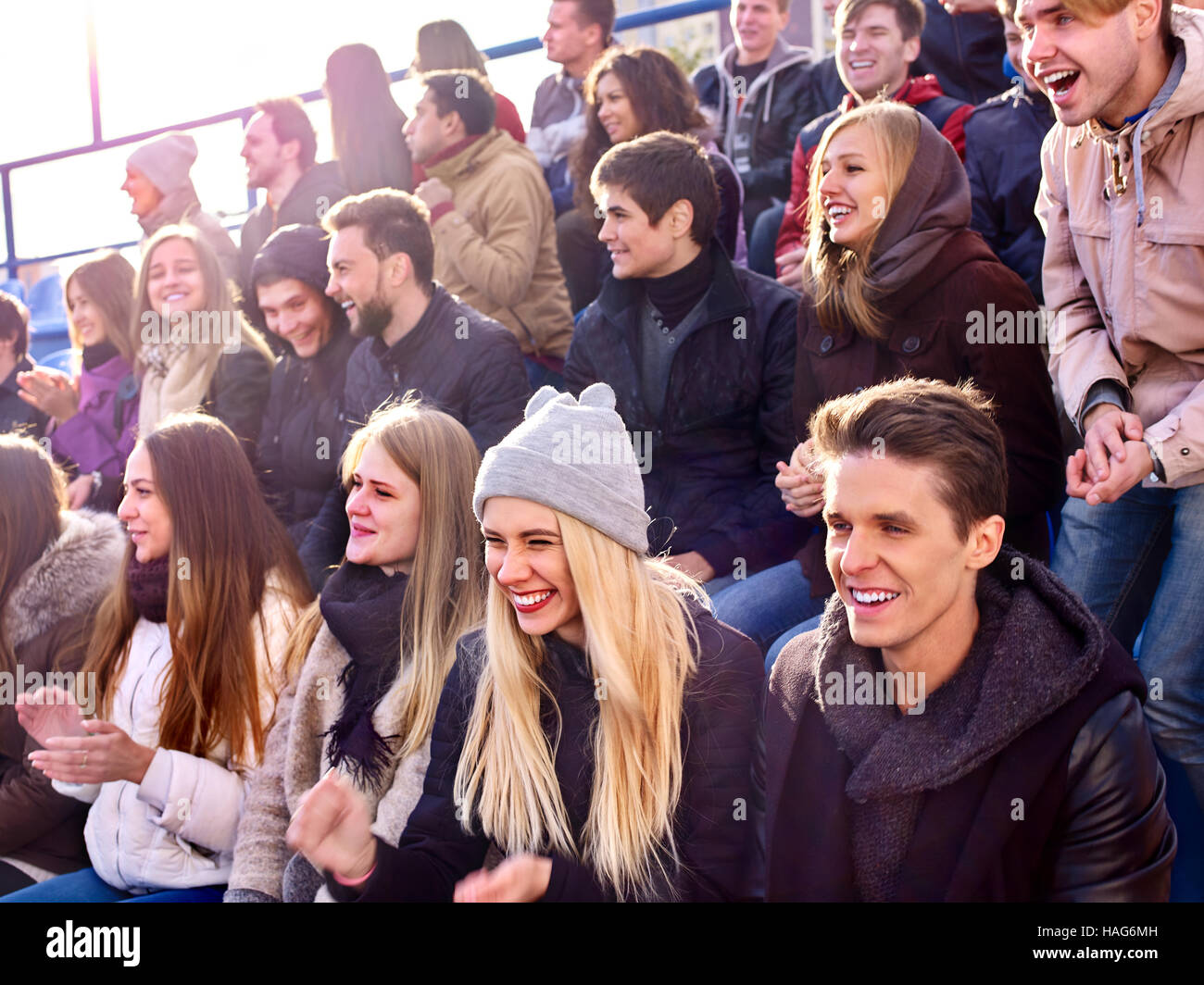 Sport fans clapping and singing on tribunes Stock Photo - Alamy
