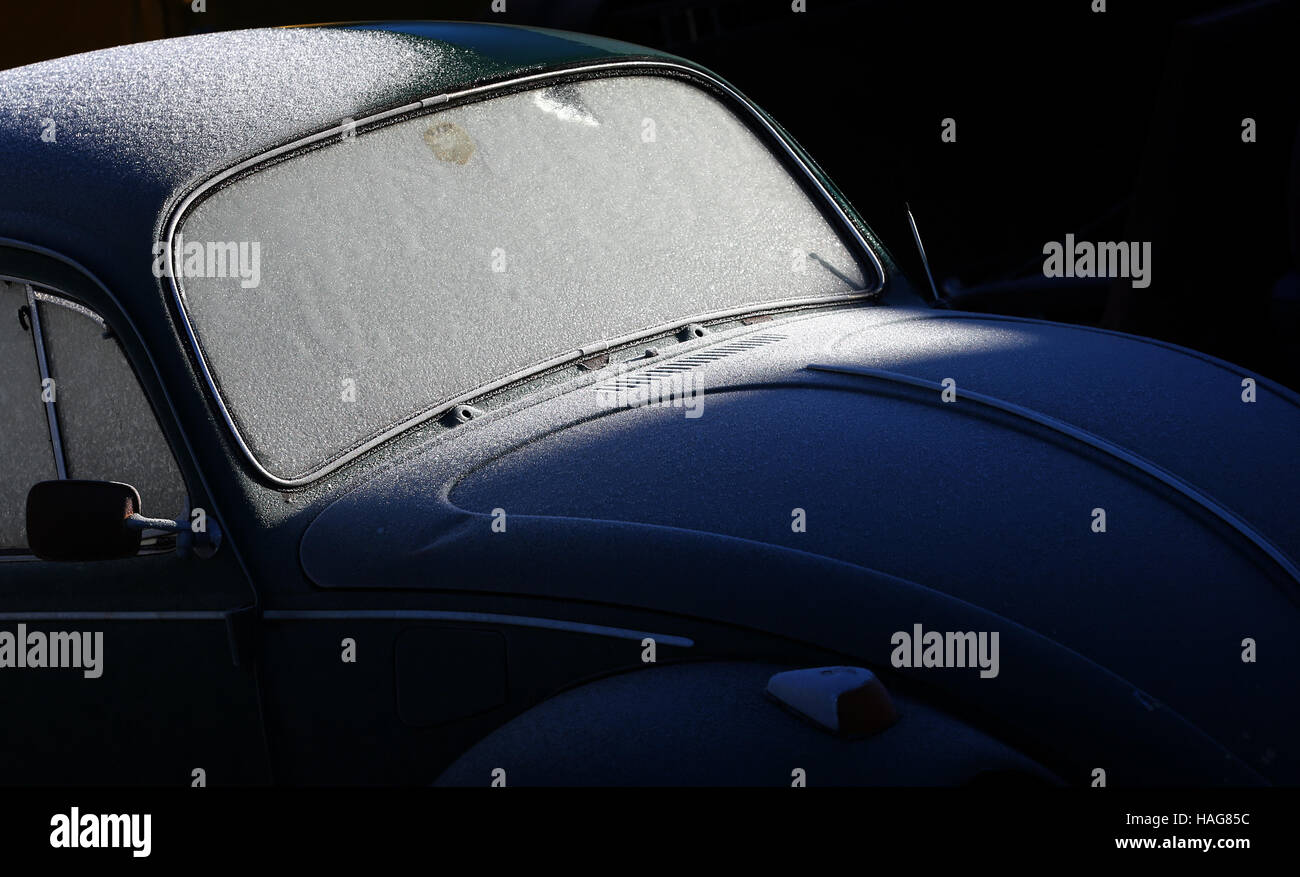 A VW Beetle covered with ice crystals shimmering in the sunshine ...