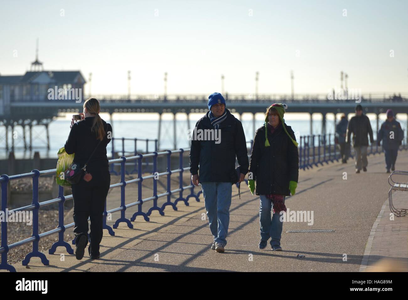 People on prom near Eastbourne pier Stock Photo - Alamy