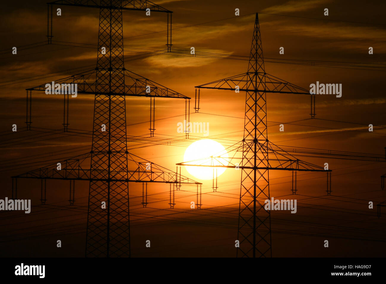 Pulheim, Germany. 30th Nov, 2016. The sunrises beyond power poles near ...