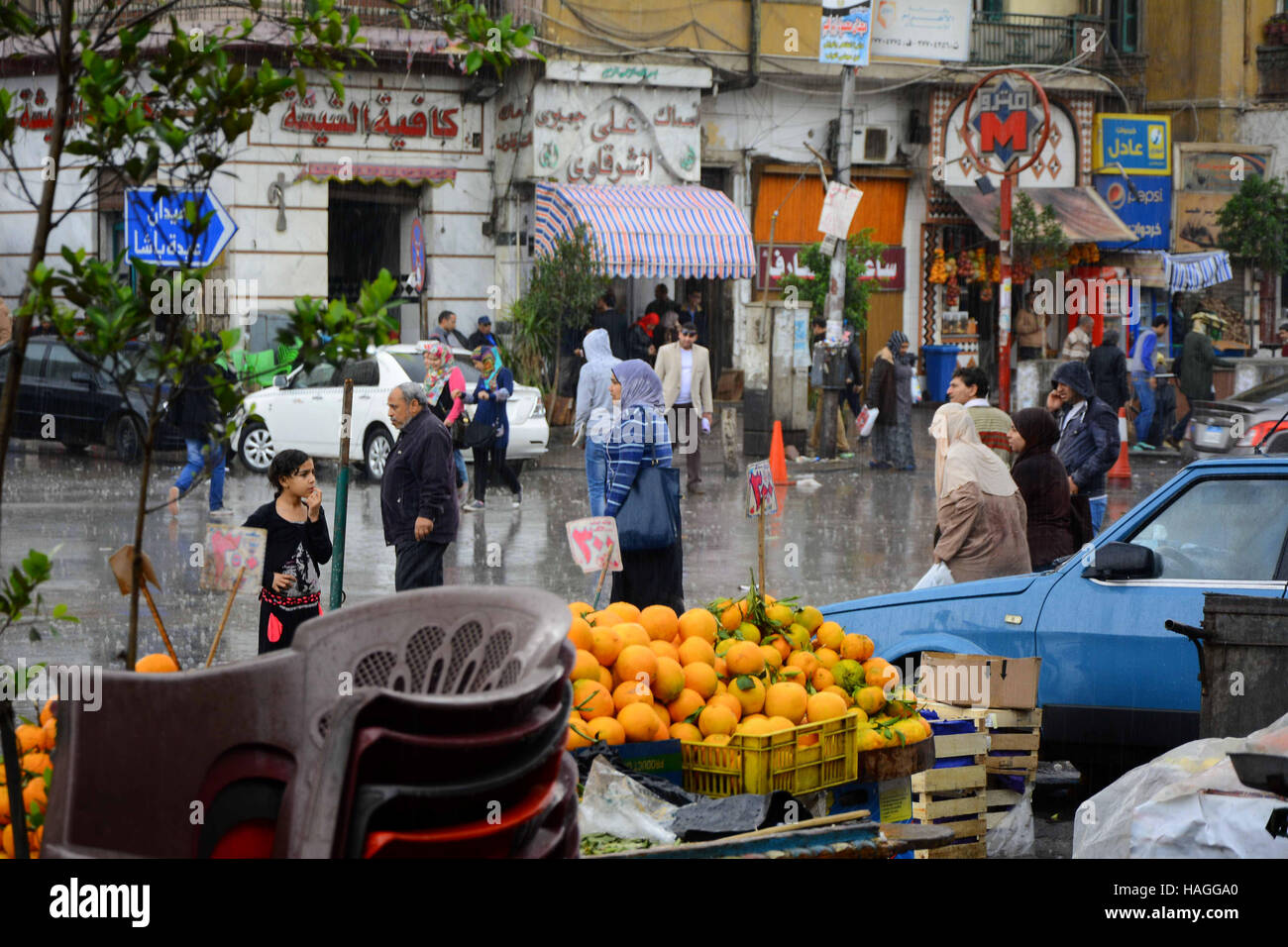 Cairo, Egypt. 12th Dec, 2015. Egyptians walk at street during rain and ...
