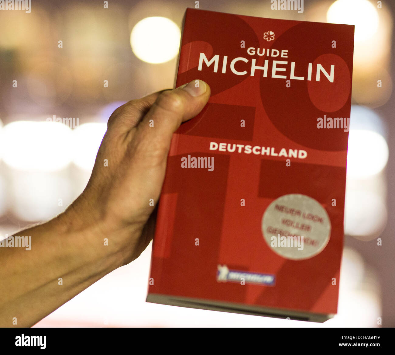 Stuttgart, Germany. 01st Dec, 2016. ILLUSTRATION: A man holds the newly ...