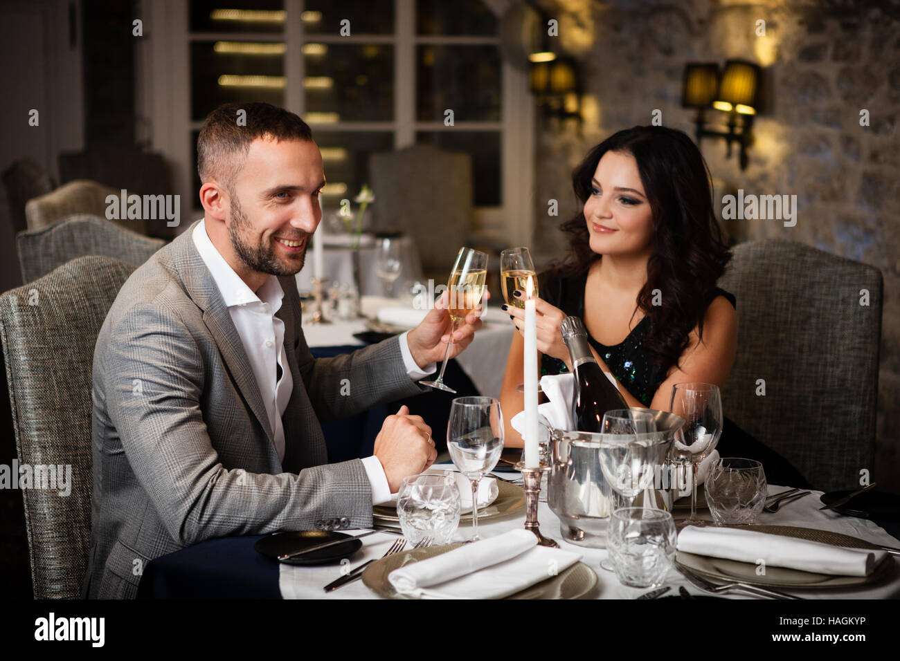 Couple celebrating in restaurant Stock Photo - Alamy