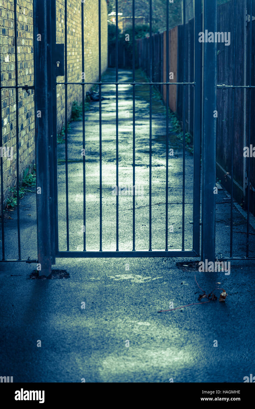 Fenced off alleyway Stock Photo - Alamy