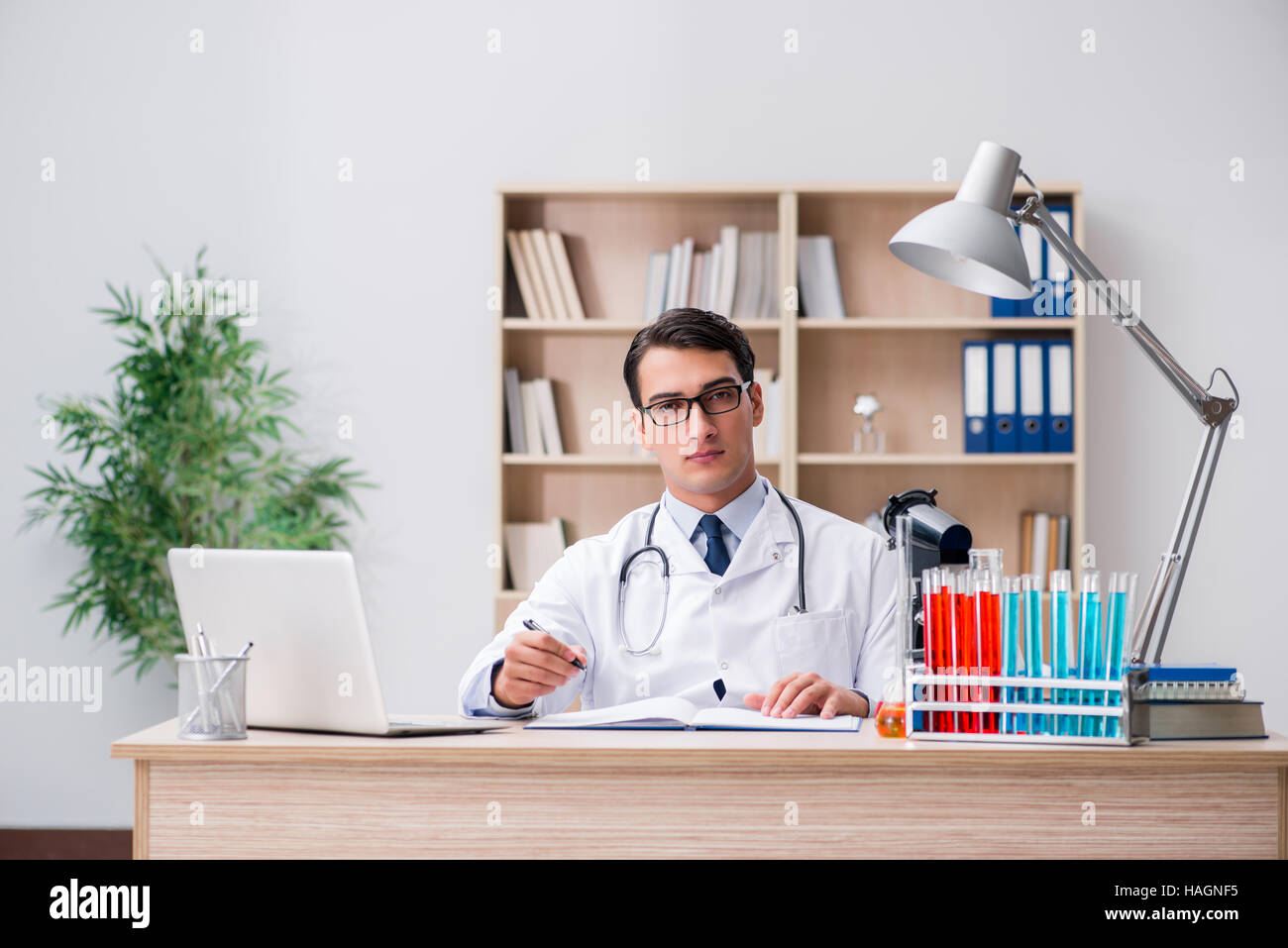 Man doctor working in the lab Stock Photo - Alamy