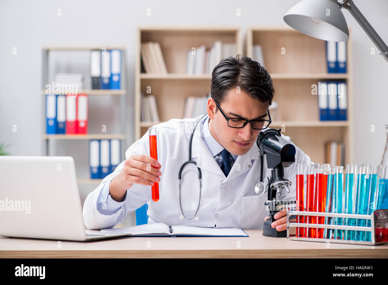 Man doctor working in the lab Stock Photo - Alamy