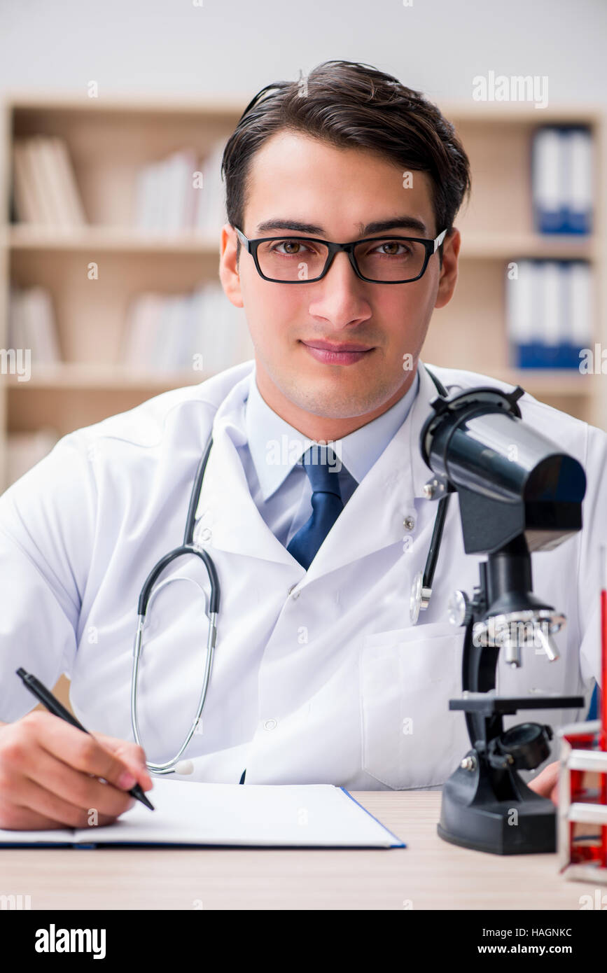 Man doctor working in the lab Stock Photo - Alamy