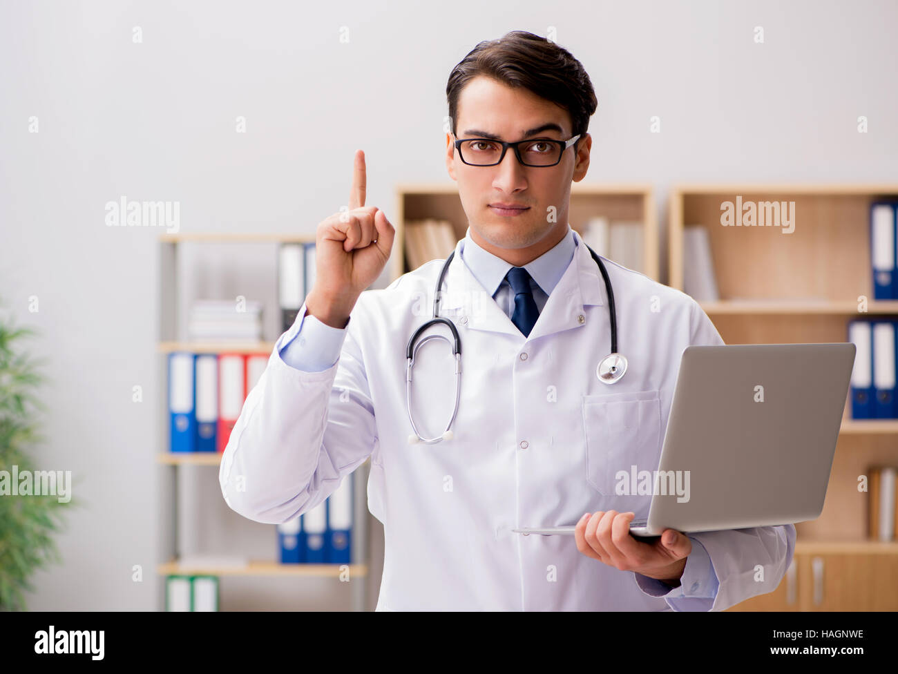 Young adult doctor with laptop computer Stock Photo - Alamy