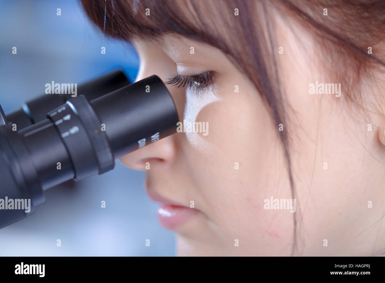 Woman and microscope hi-res stock photography and images - Alamy