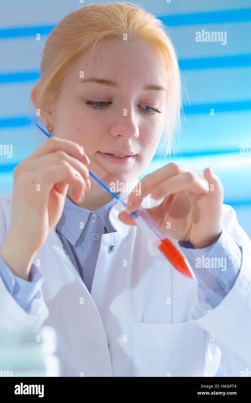 Young woman technician use pipette in laboratory Stock Photo - Alamy