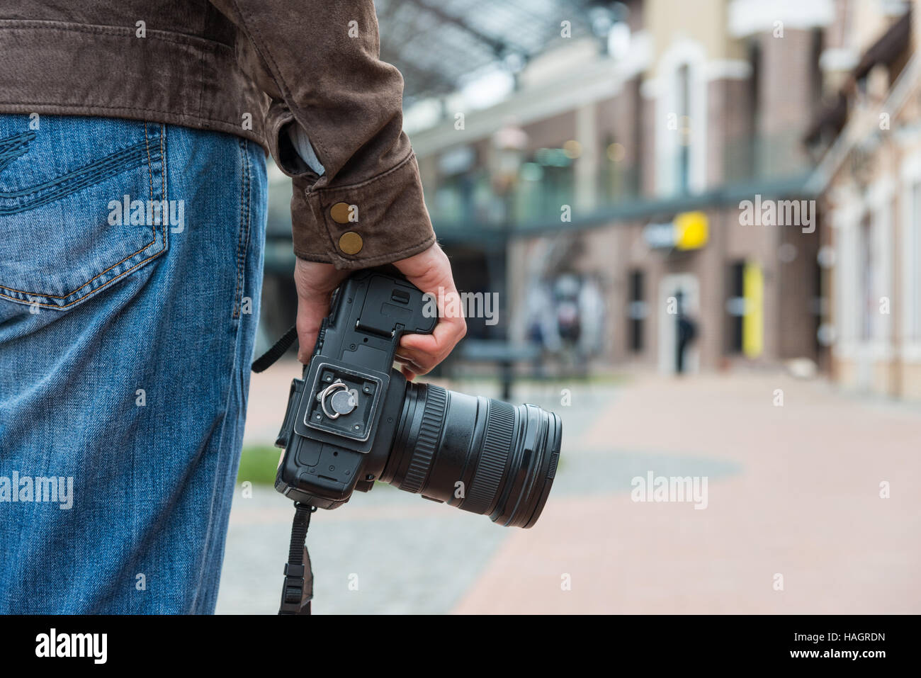Photographer with camera in the city Stock Photo - Alamy