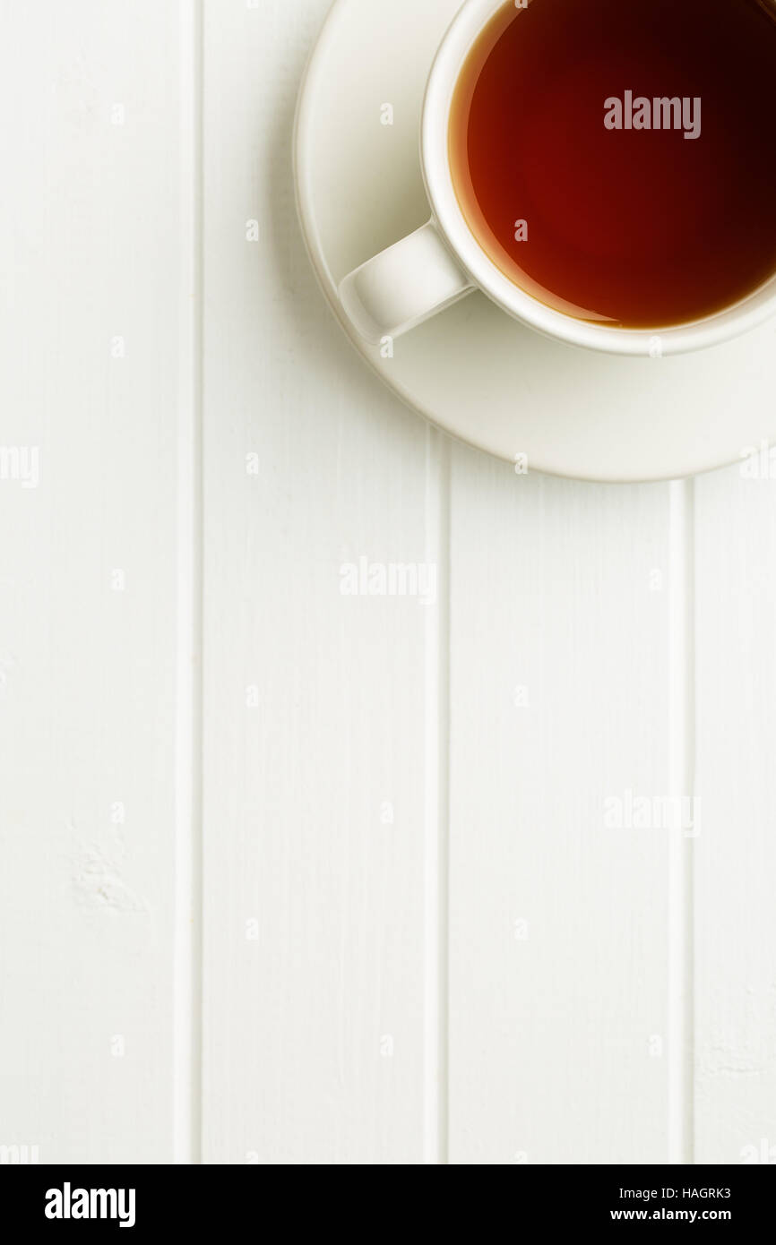 A cup of tea on white table. Top view Stock Photo - Alamy