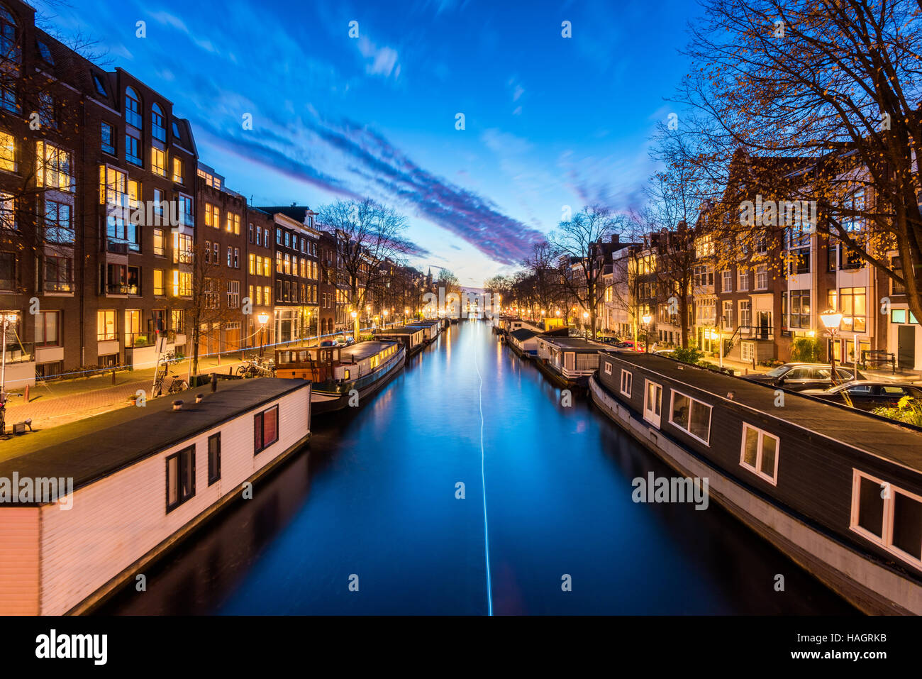 Canal with House Boats in Amsterdam Netherlands Stock Photo - Alamy