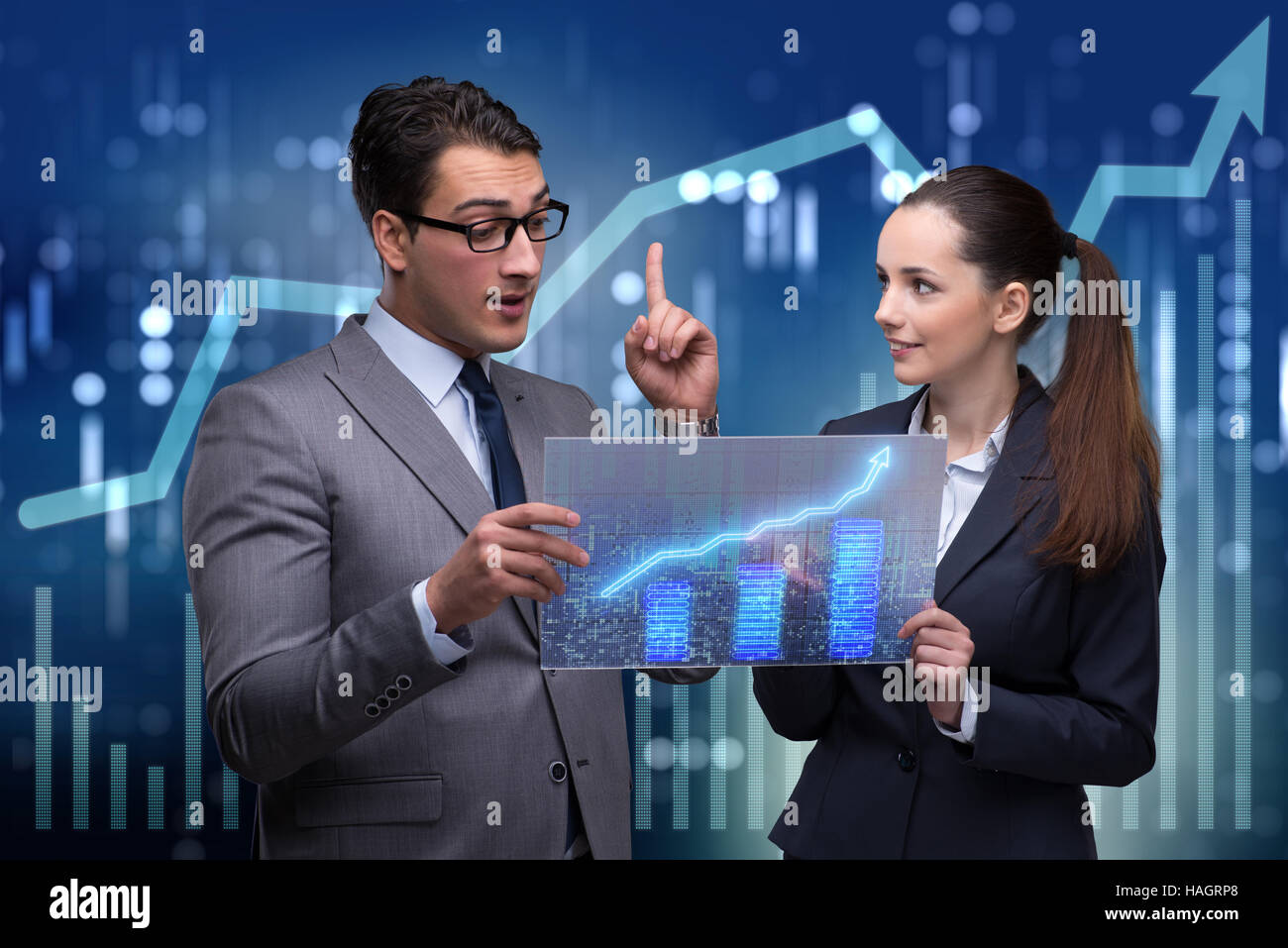 Business people discussing stock chart trends Stock Photo - Alamy