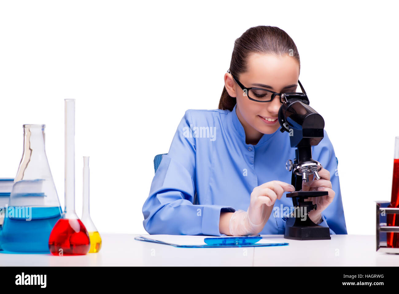Lab chemist working with microscope and tubes Stock Photo - Alamy