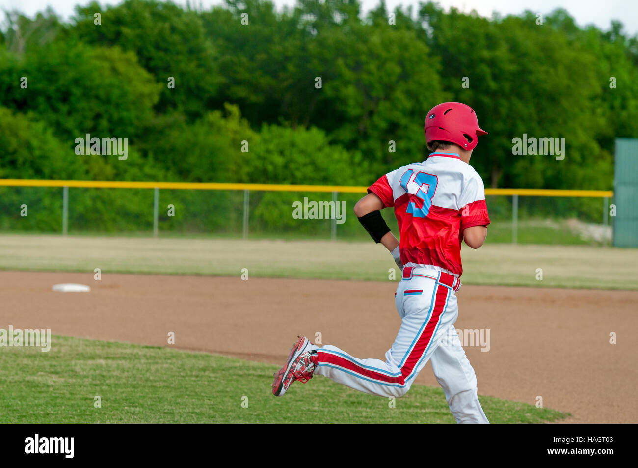 Baseball player running the bases Stock Photo - Alamy