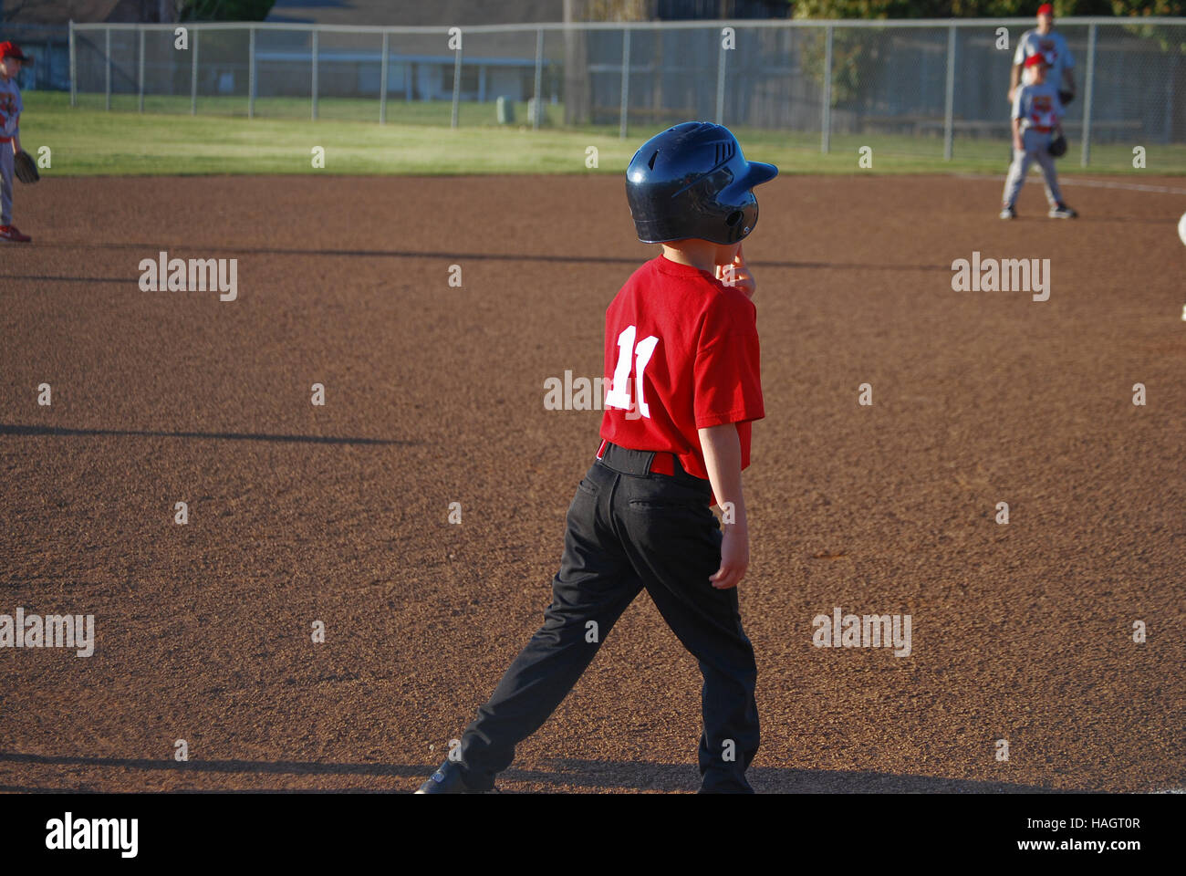 Baseball boy standing on base hi-res stock photography and images - Alamy