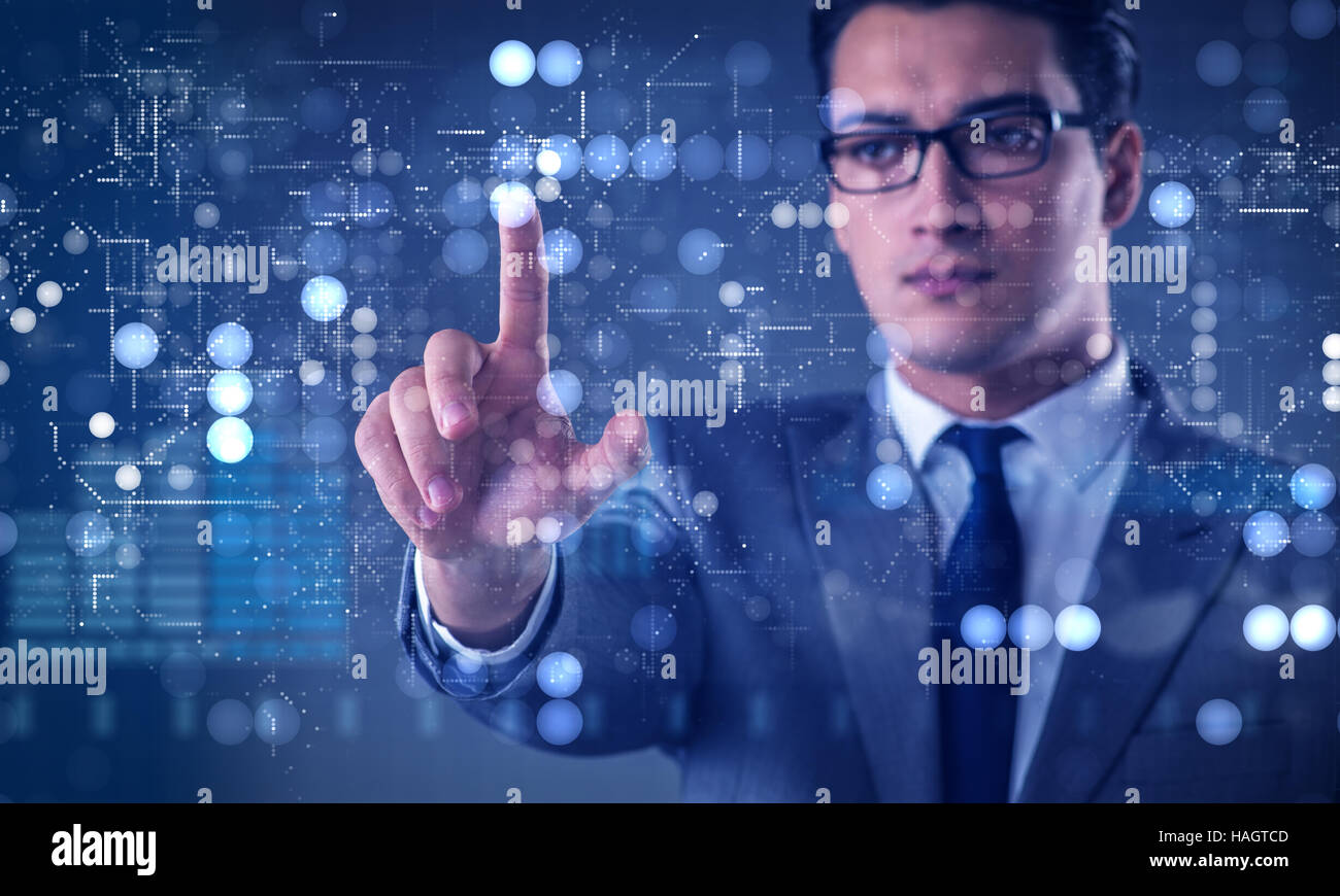 Businessman pressing virtual buttons in futuristic concept Stock Photo ...