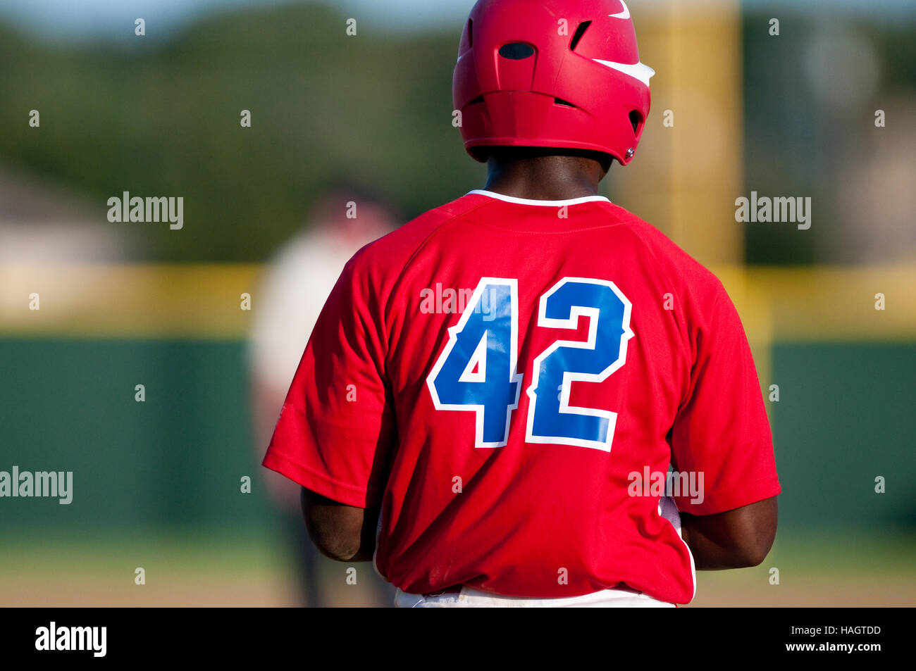 High school player during a game in red jersey Stock Photo - Alamy