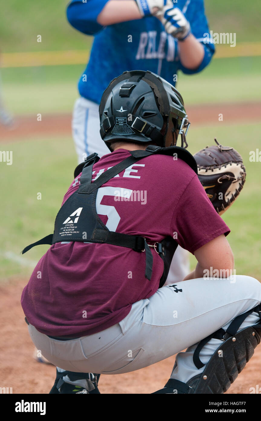 Young baseball boy catching behind home plate Stock Photo - Alamy