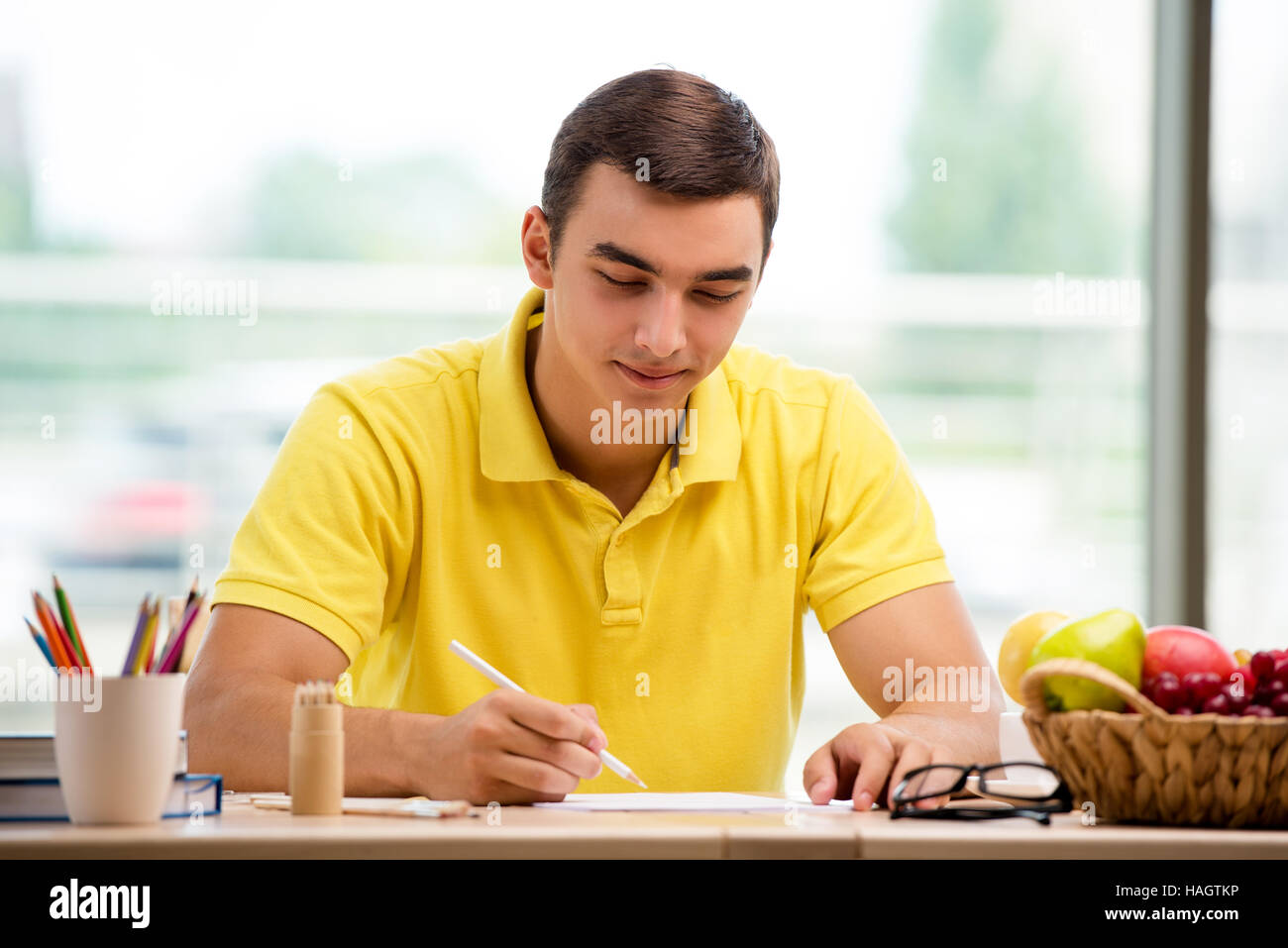 Young man drawing pictures in studio Stock Photo - Alamy