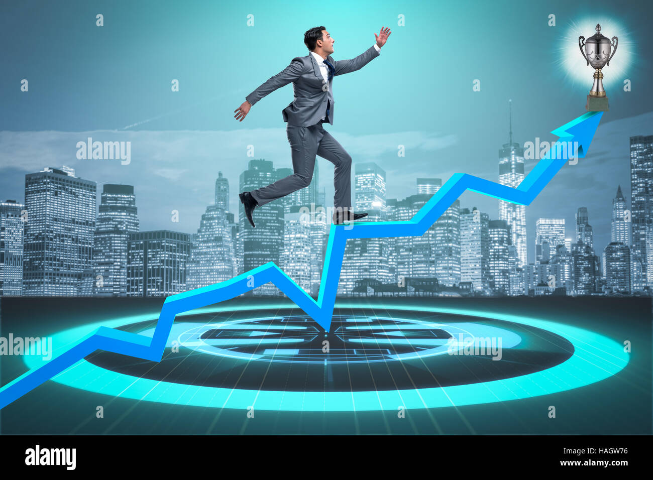 Businessman running towards prize cup trophy Stock Photo - Alamy