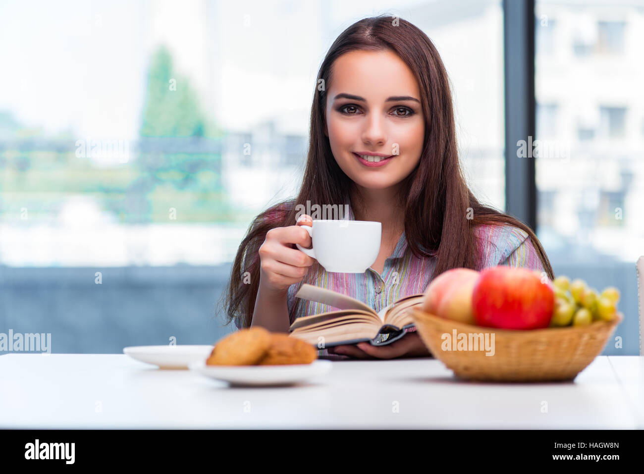 Young girl having breakfast on the morning Stock Photo - Alamy
