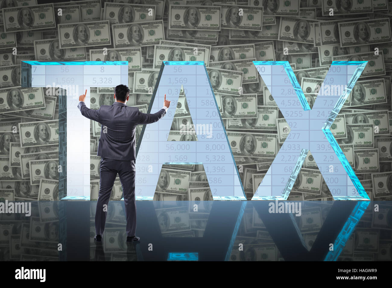 Businessman in high taxes concept Stock Photo - Alamy