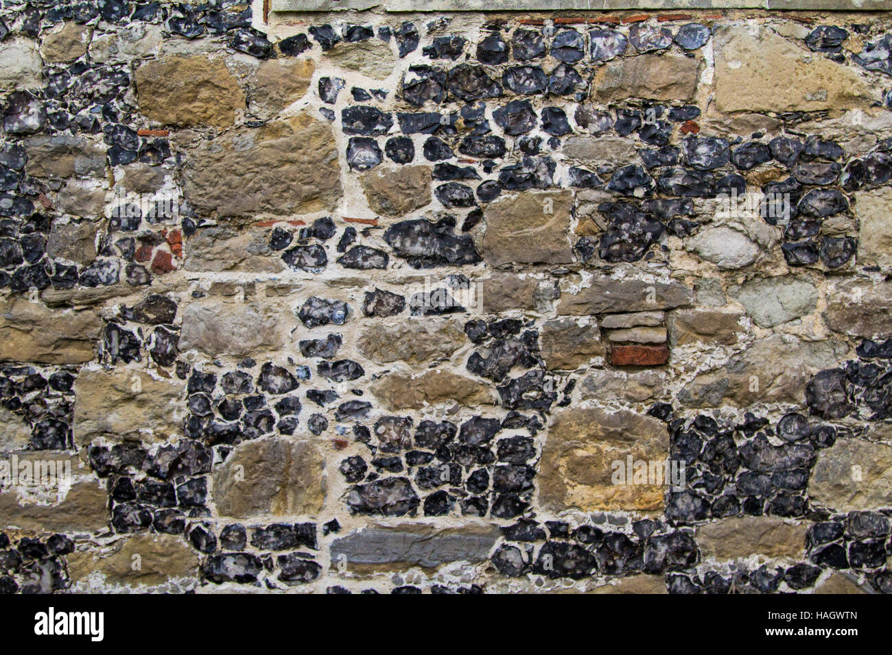 Flint and stone pattern on a church wall Stock Photo - Alamy