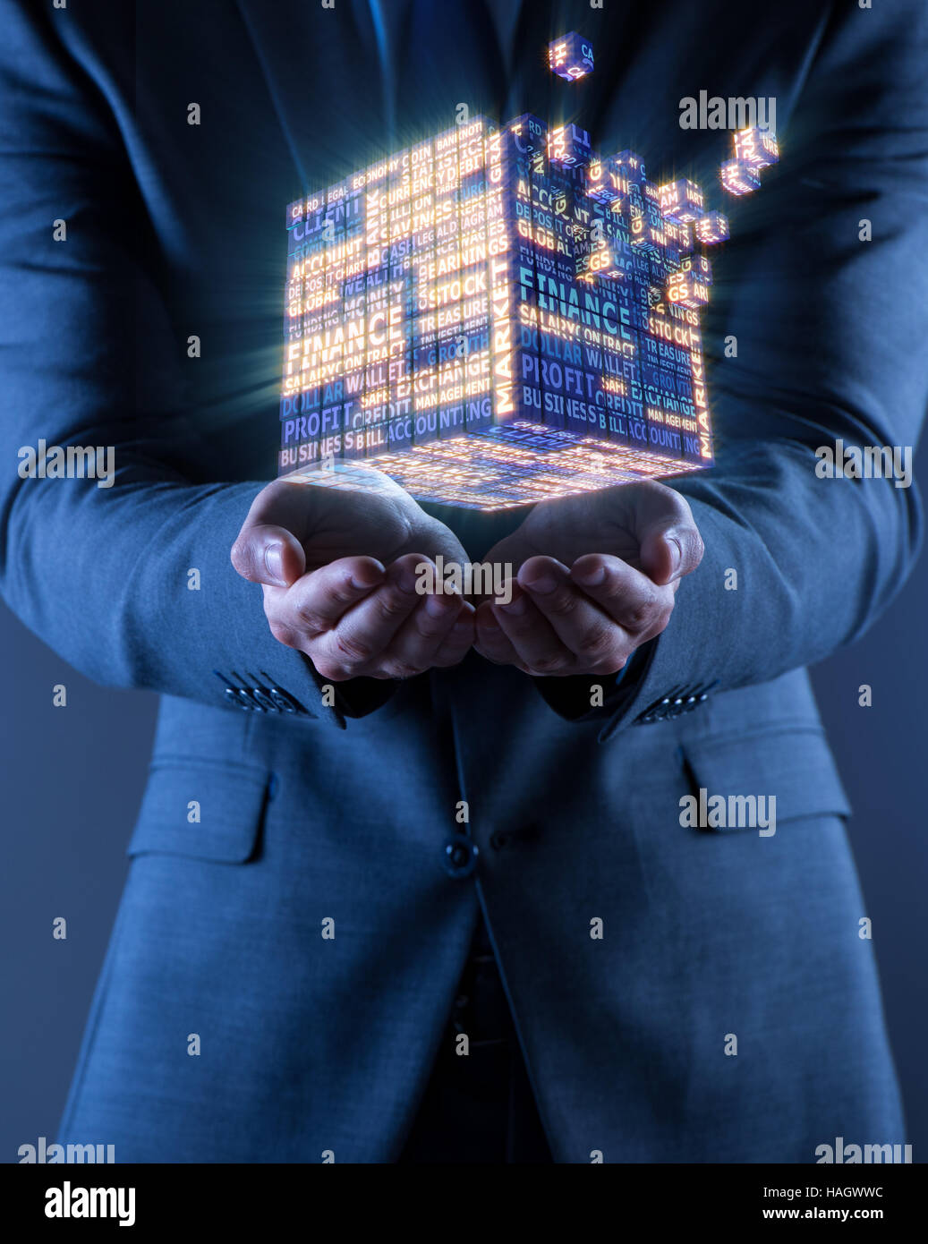 Businessman holding financial cube in business concept Stock Photo - Alamy