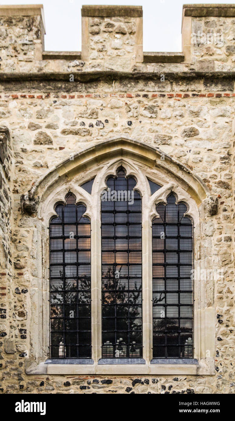 Arched window on the stone wall of a city church Stock Photo - Alamy
