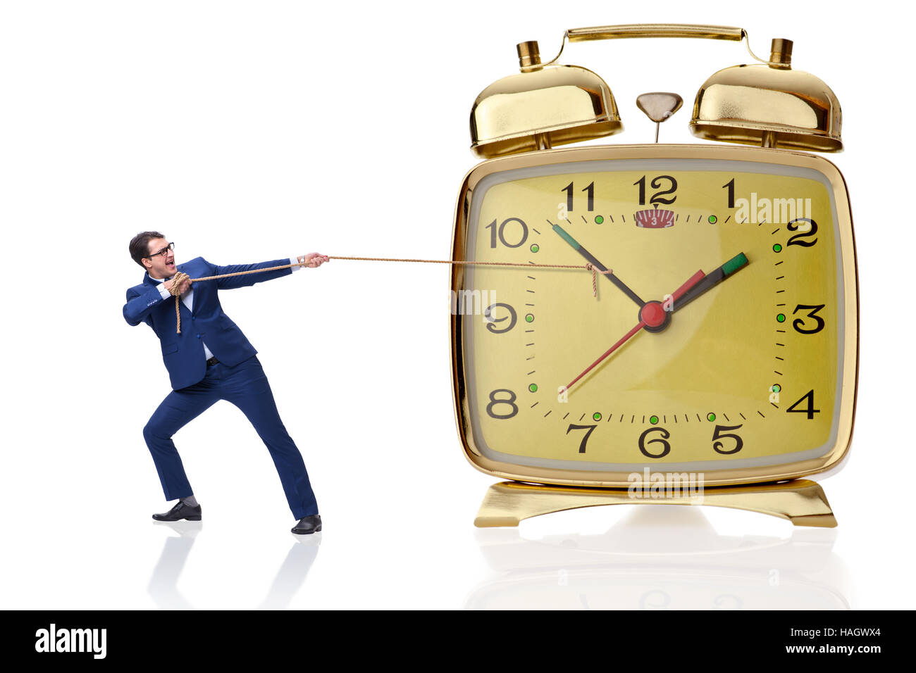 Businessman pulling clock in time concept Stock Photo - Alamy