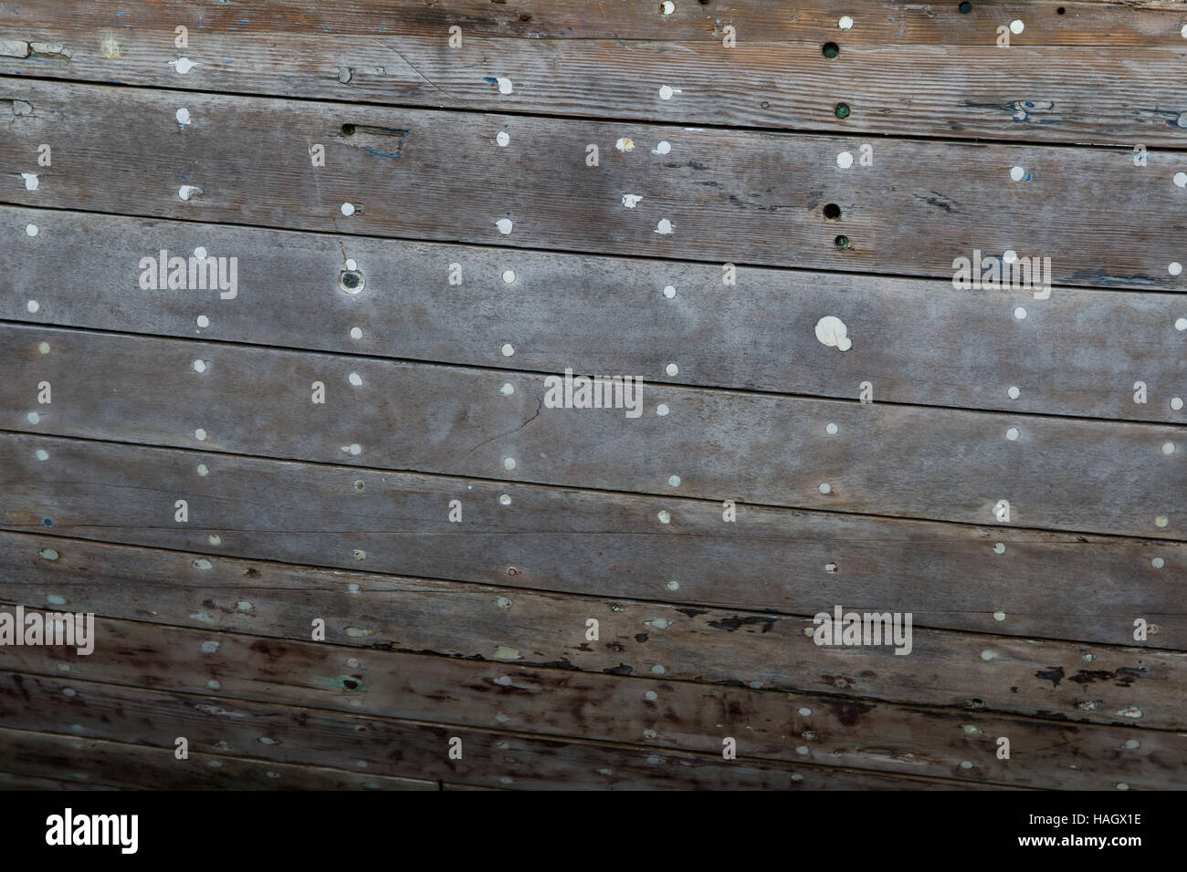 Small Boat Hull stripped of paint showing wooden board construction ...