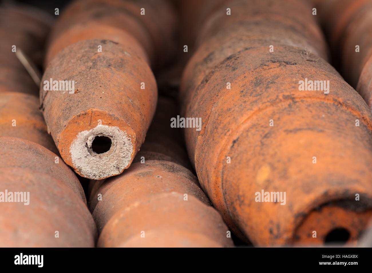 A stack of used clay pots in the garden Stock Photo - Alamy