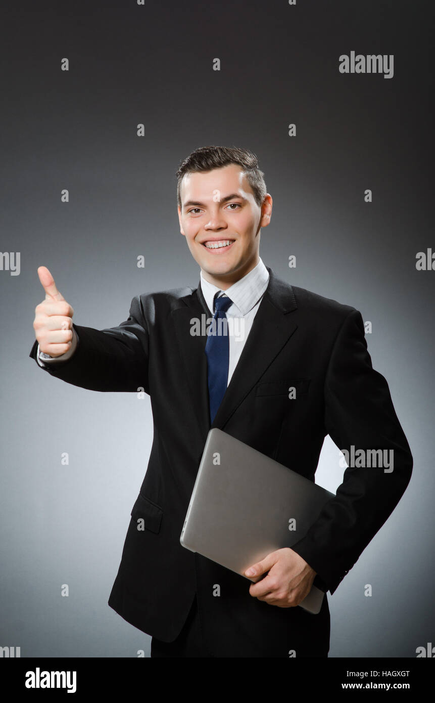 Man with laptop and thumbs up Stock Photo - Alamy