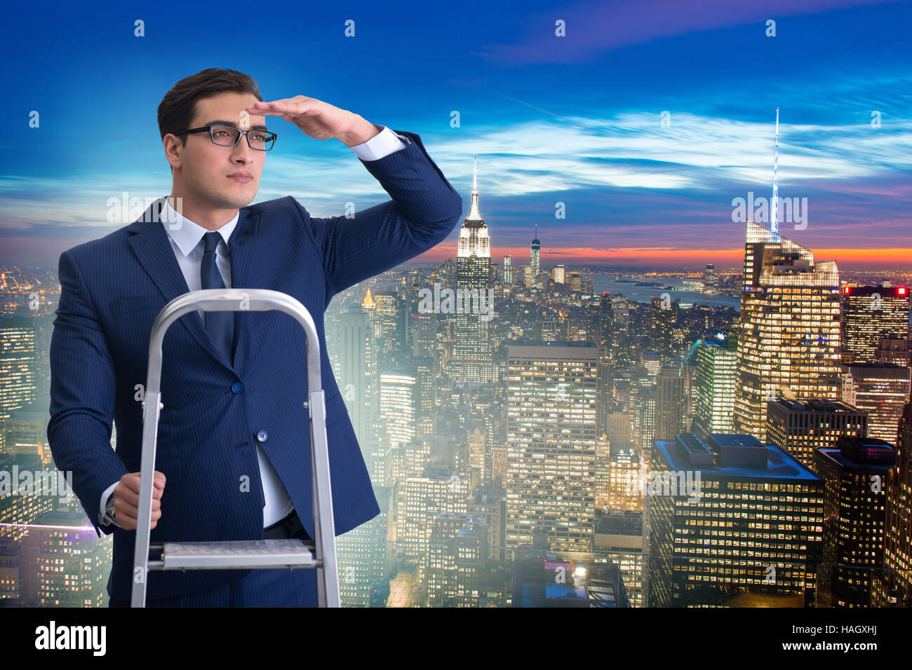 Businessman climbing ladder in business concept Stock Photo - Alamy