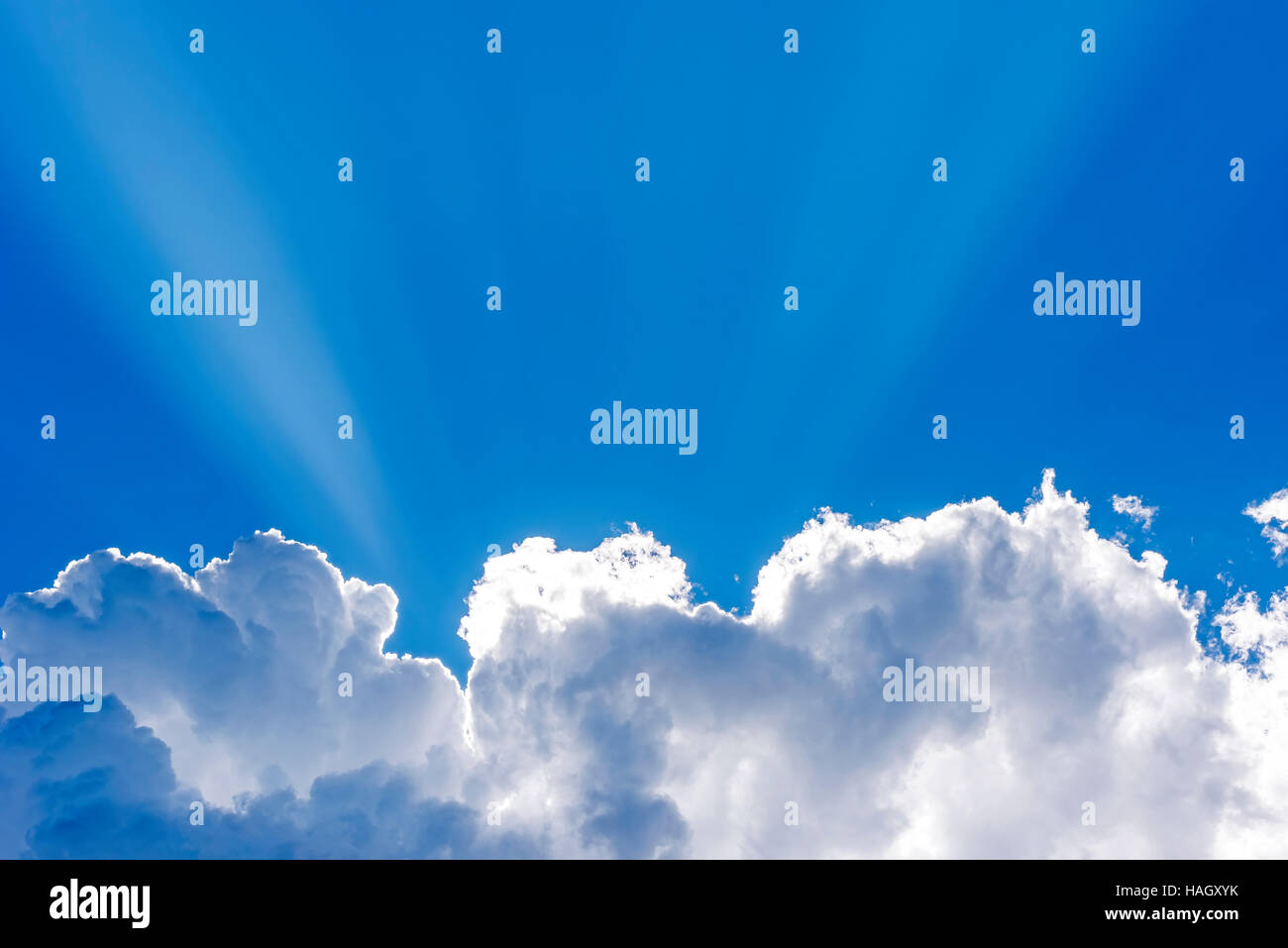 Blue sky and cloud with rays of light Stock Photo - Alamy