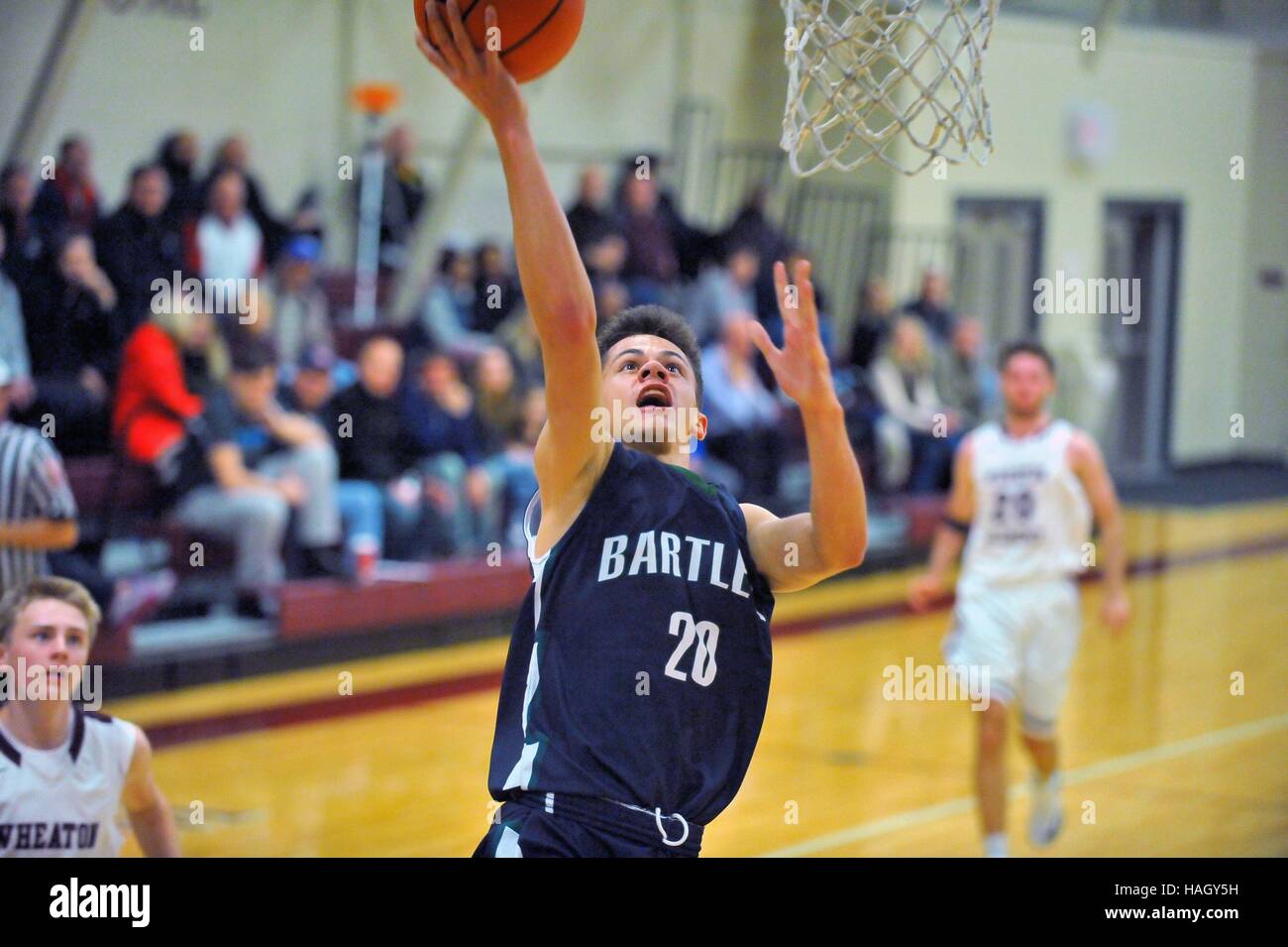 High school player finishing off a driving layup to the hoop. USA Stock ...