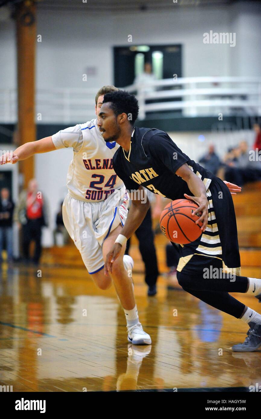 Player driving the baseline and past a defender during a high school ...